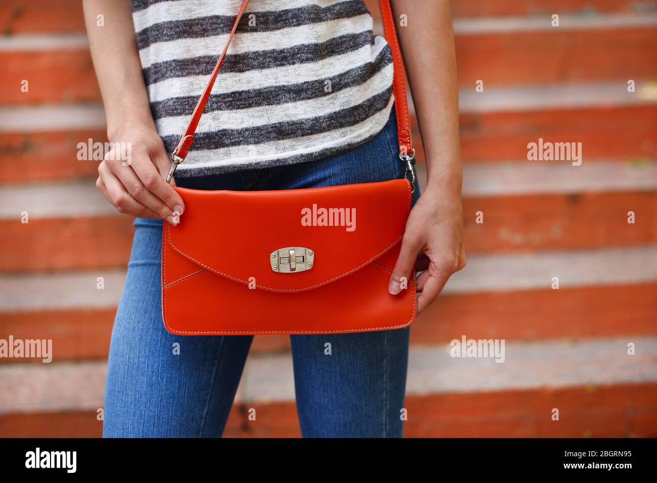 Girl with bag over his shoulder outdoors Stock Photo - Alamy