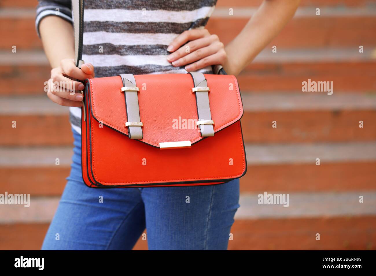 Girl with bag over his shoulder outdoors Stock Photo - Alamy