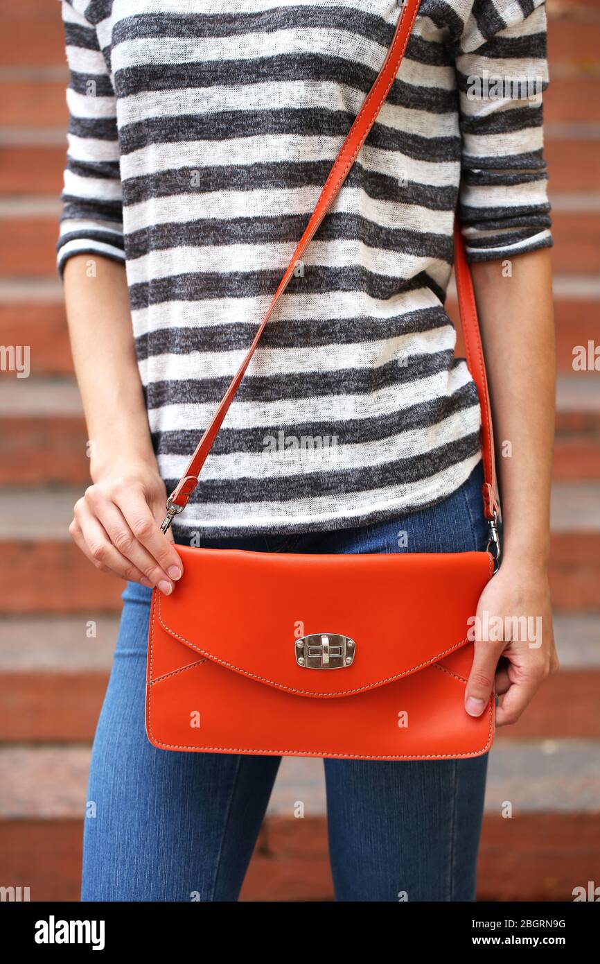 Girl with bag over his shoulder outdoors Stock Photo - Alamy