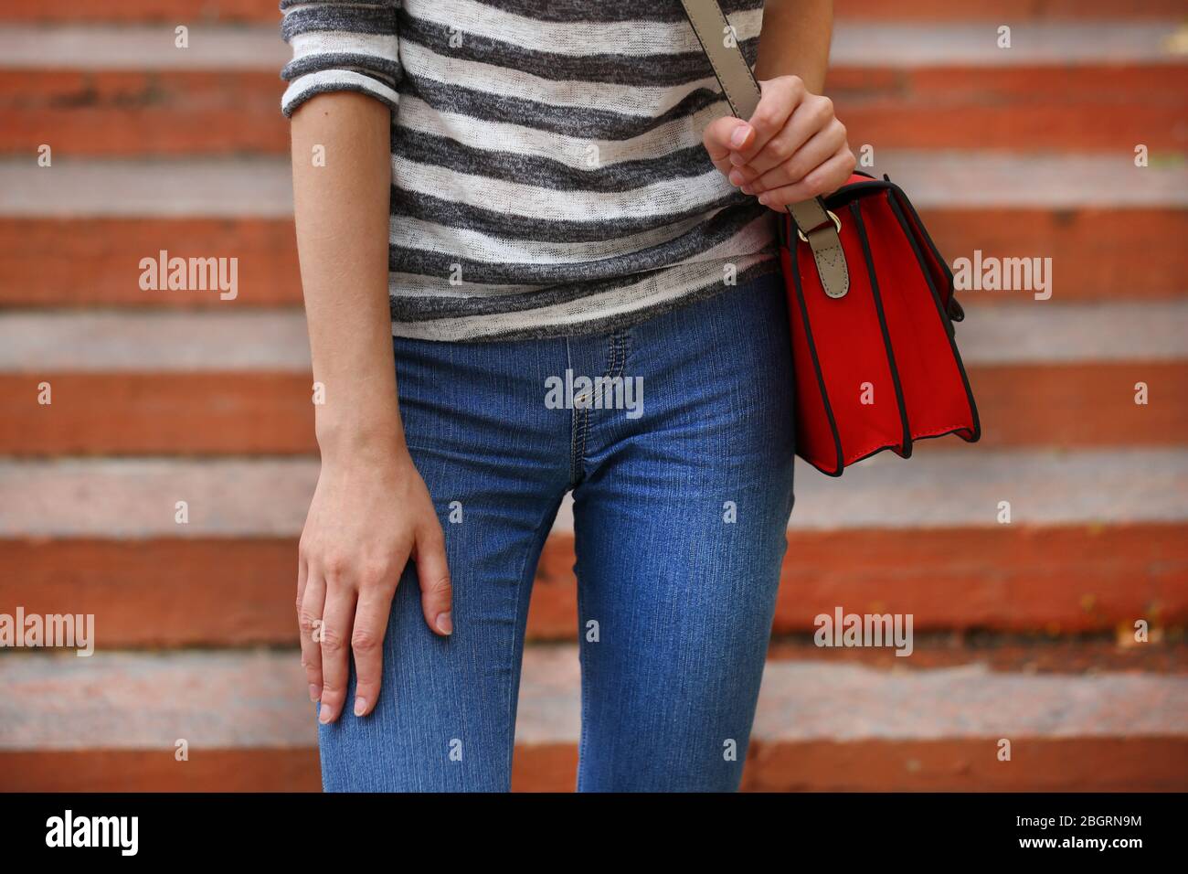 Girl with bag over his shoulder outdoors Stock Photo - Alamy