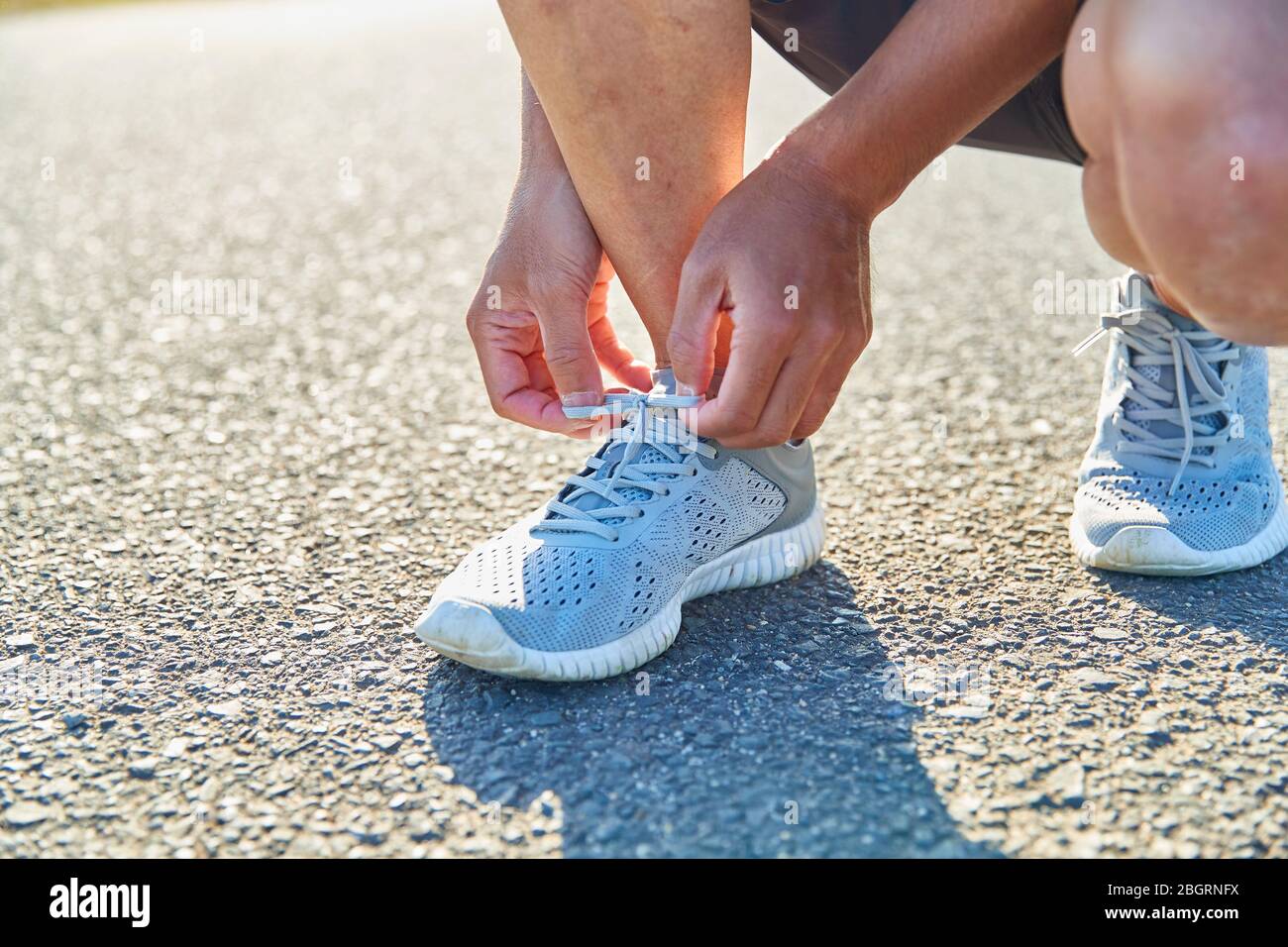 Japanese men tying hi-res stock photography and images - Alamy