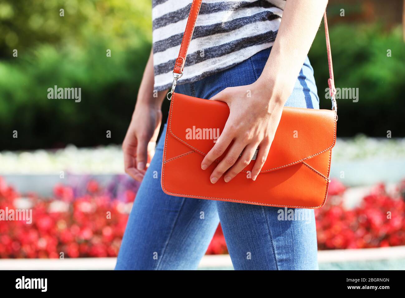 Girl with bag over his shoulder outdoors Stock Photo - Alamy