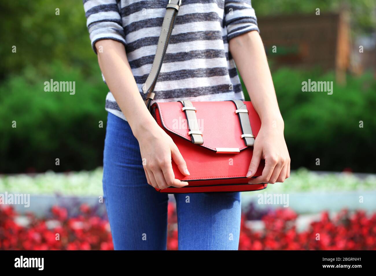 Girl with bag over his shoulder outdoors Stock Photo - Alamy