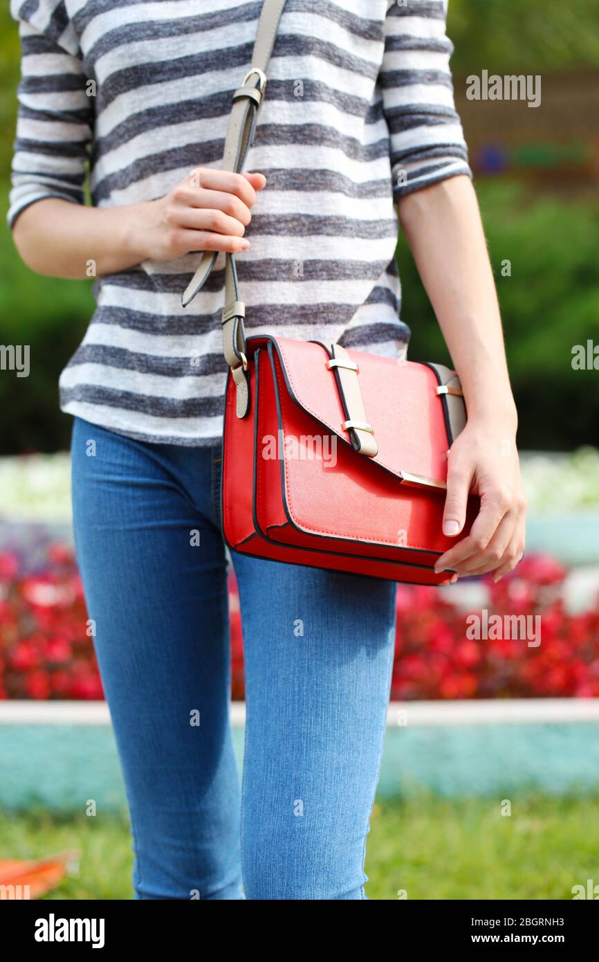 Girl with bag over his shoulder outdoors Stock Photo - Alamy