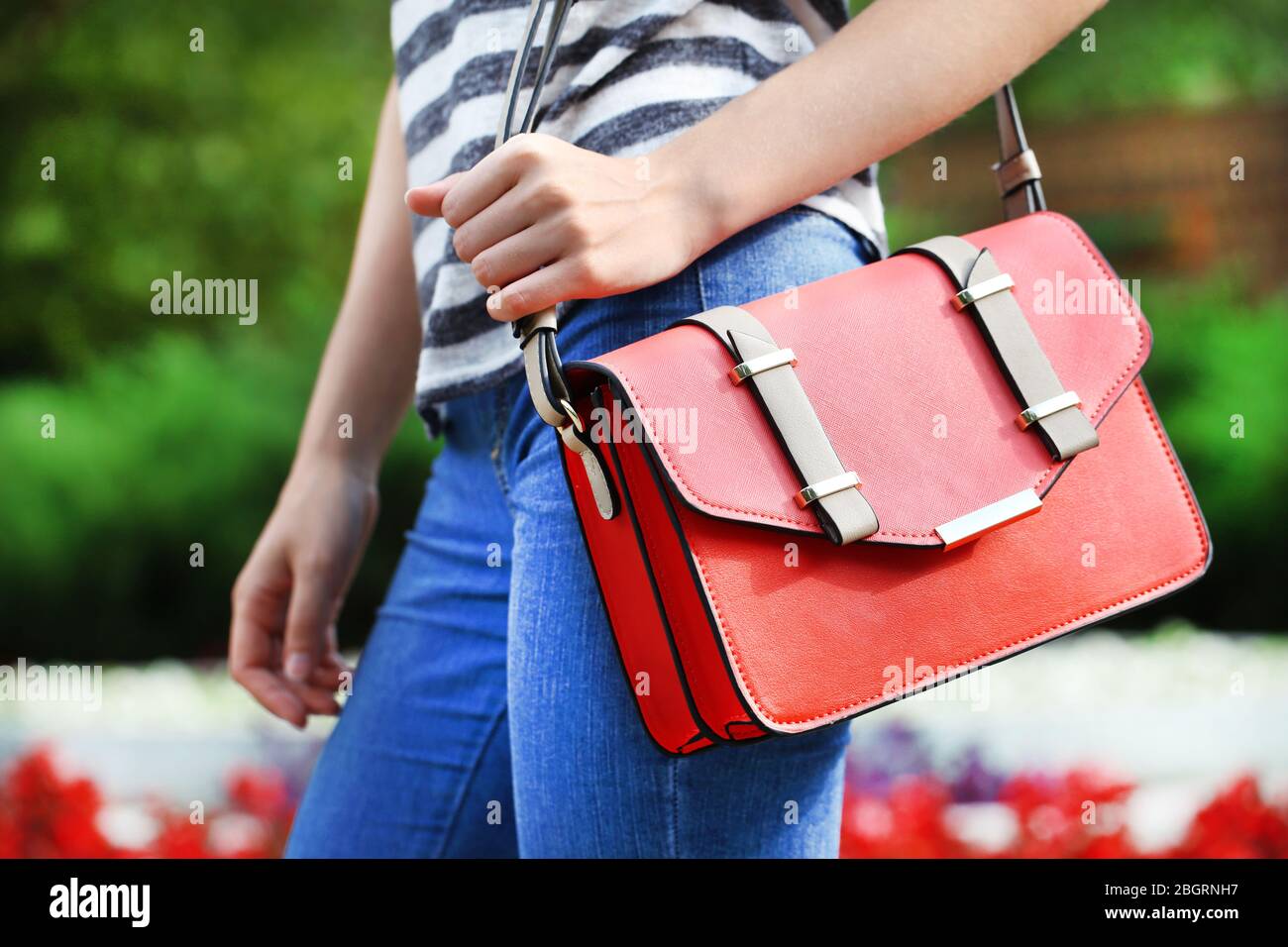 Girl with bag over his shoulder outdoors Stock Photo - Alamy