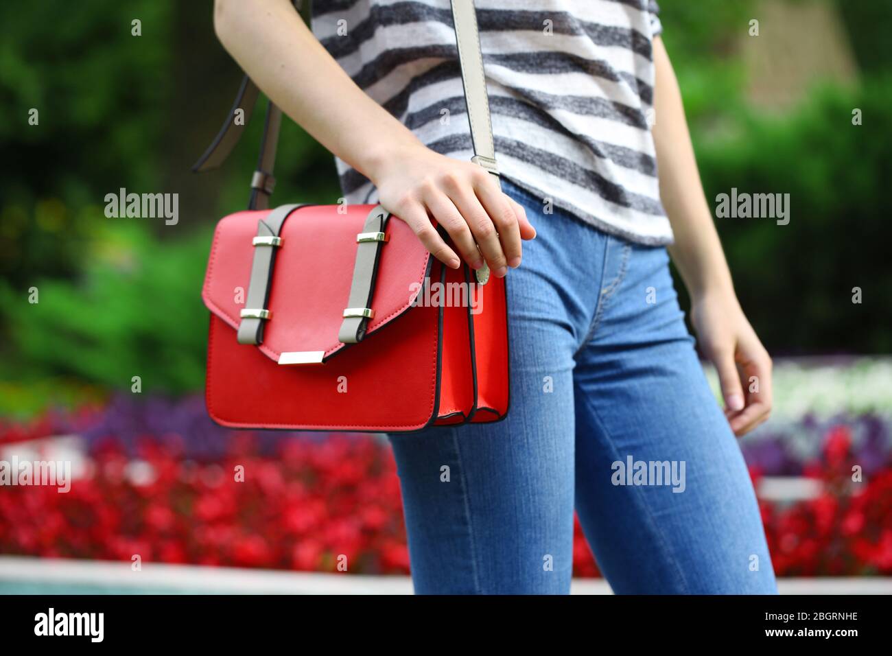 Girl with bag over his shoulder outdoors Stock Photo - Alamy