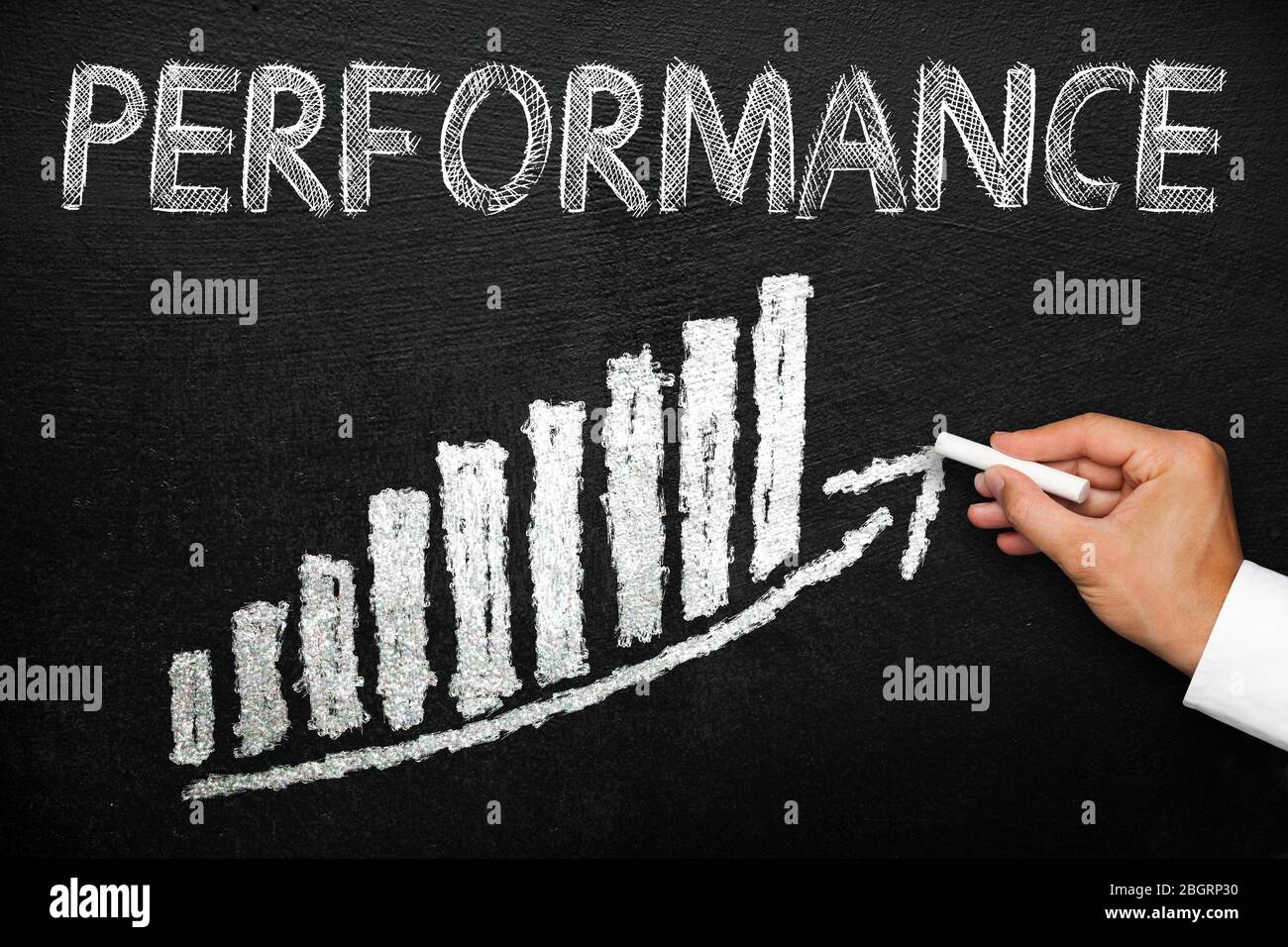 Blackboard with handwritten performance text. Arrow going upwards and ...