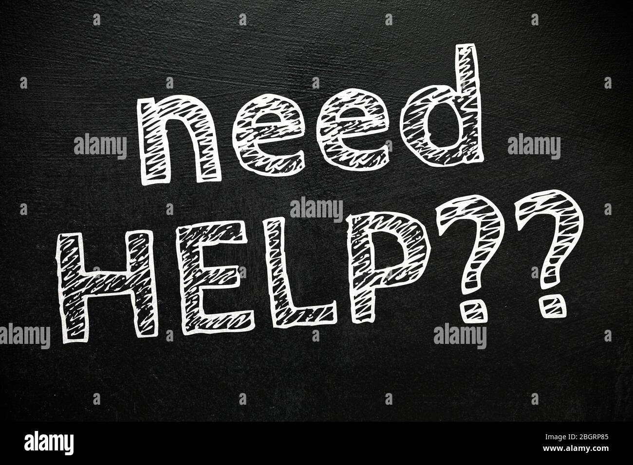 Blackboard with the writing need help. A question written with a white ...
