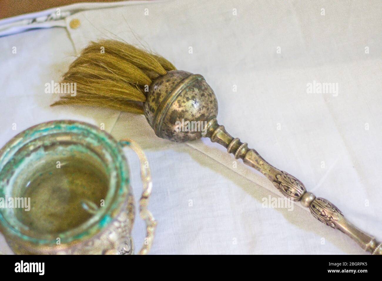 inside the church water blessed by the priest ready for baptism ...