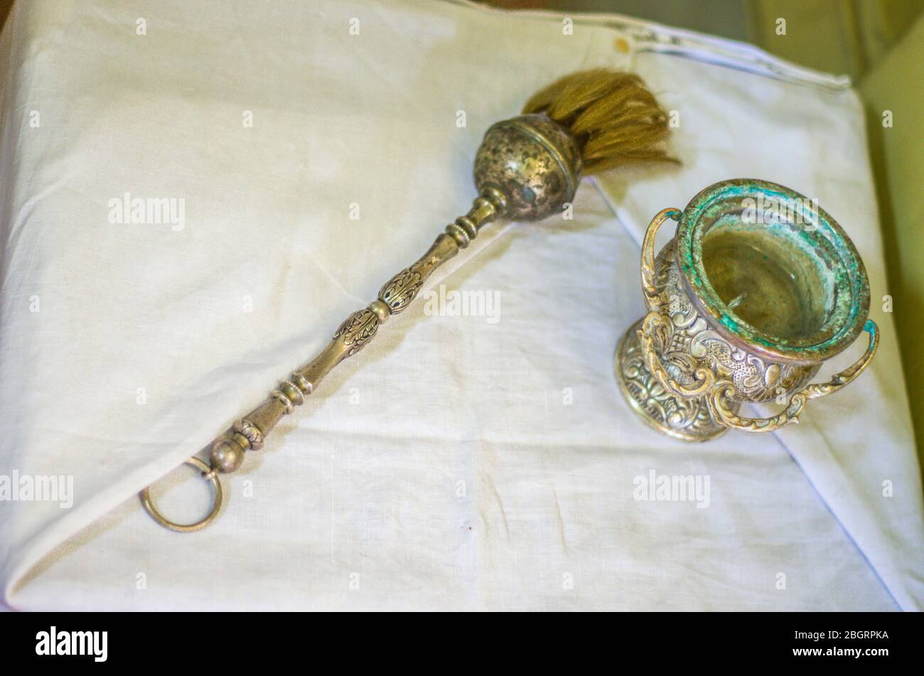 inside the church water blessed by the priest ready for baptism ...