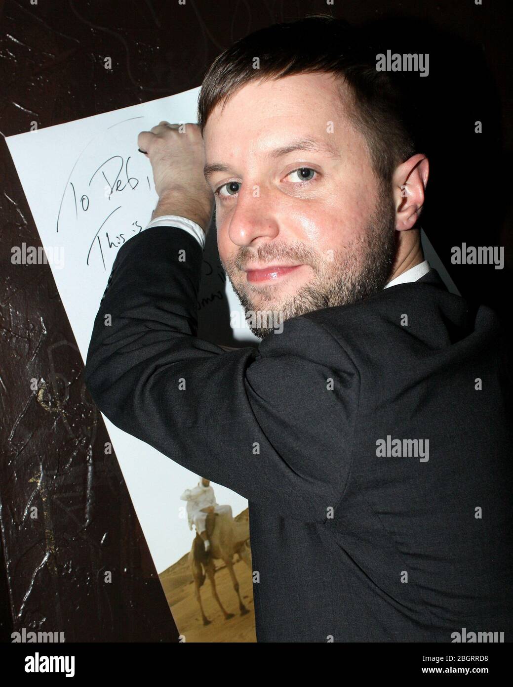 New York, NY, USA. 1 December, 2010. Ryan Duffy, signs a movie poster ...