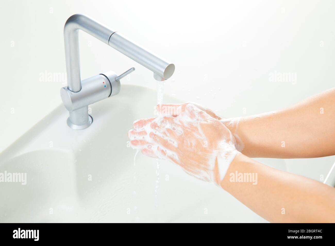 Woman washing hands Stock Photo - Alamy