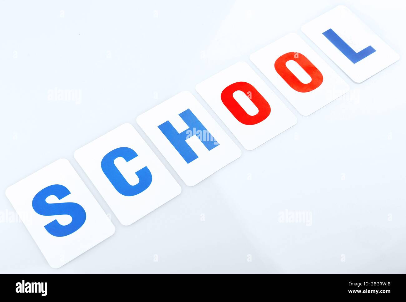 School word formed by educational paper cards isolated on white Stock ...