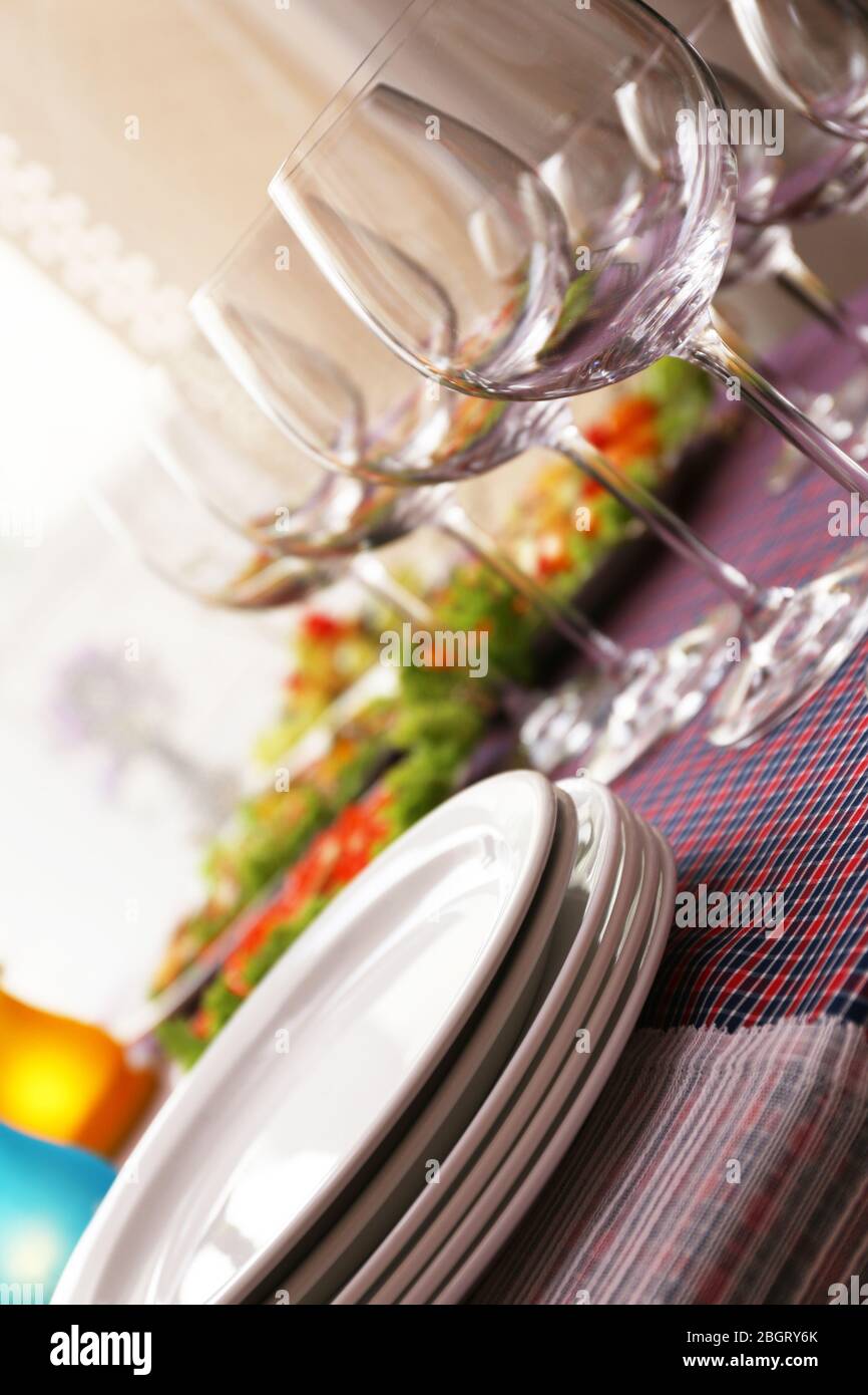 Buffet table with dishware waiting for guests Stock Photo - Alamy