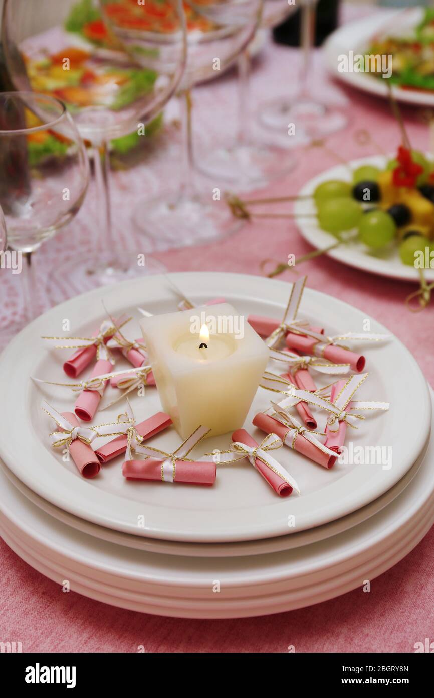 Buffet table with dishware and candle waiting for guests Stock Photo ...