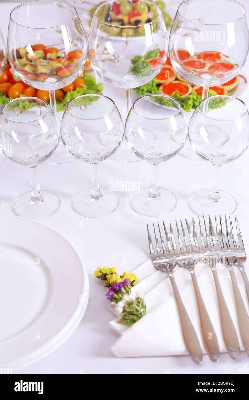 Buffet table with dishware waiting for guests Stock Photo - Alamy