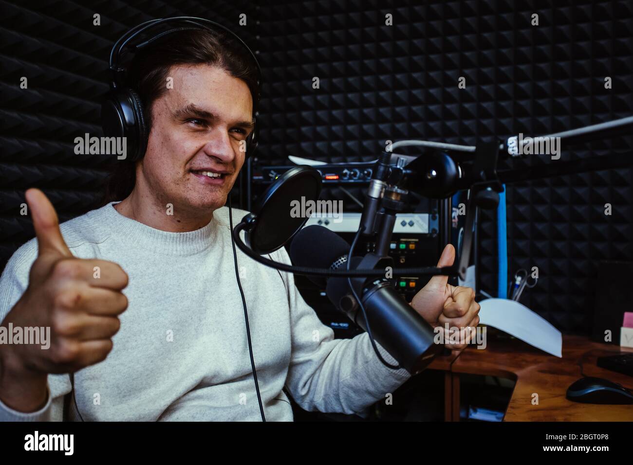 Talking male radio presenter in radio station Stock Photo - Alamy