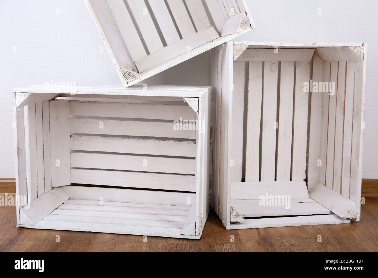 Empty wooden crates in room Stock Photo - Alamy