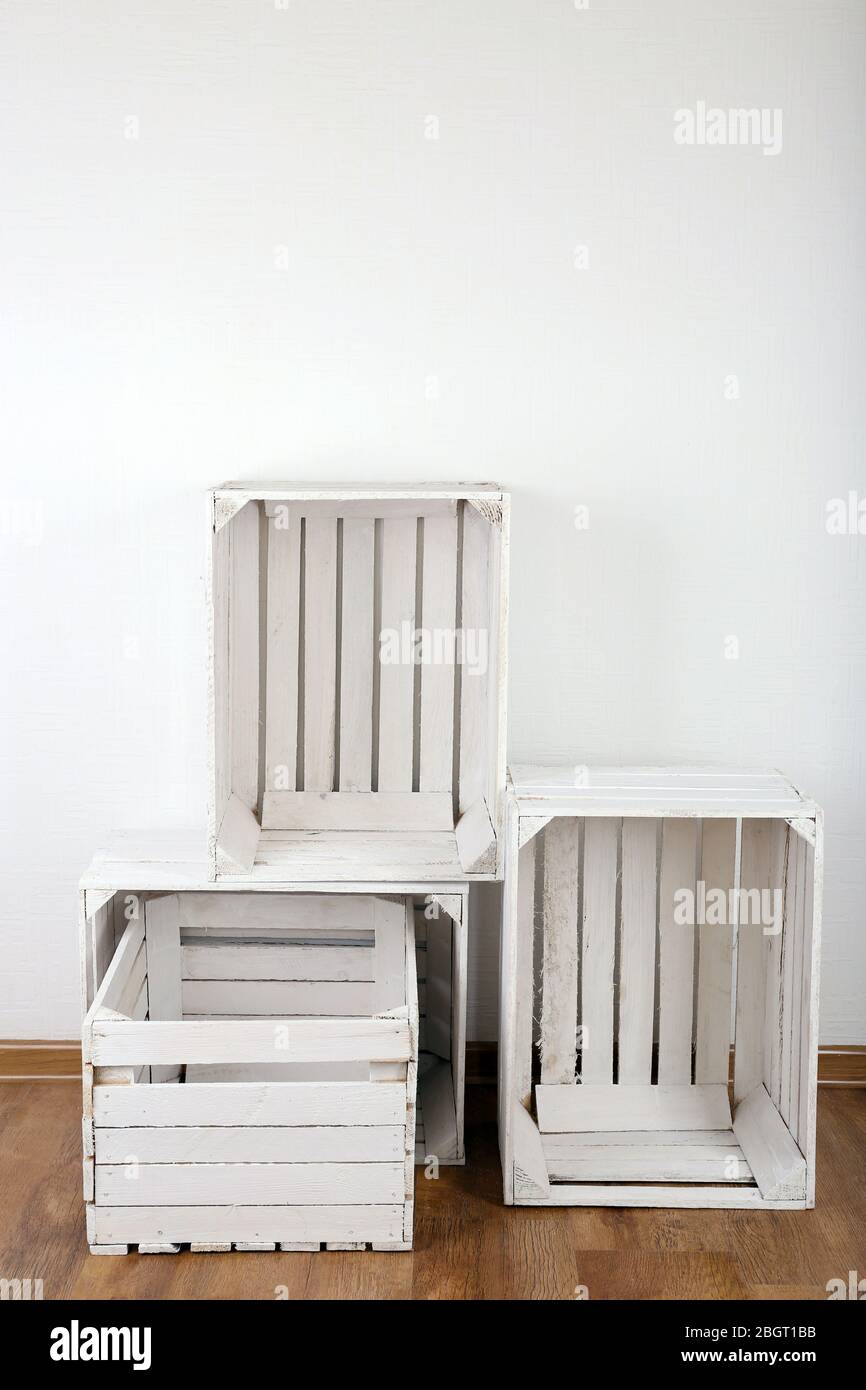 Empty wooden crates in room Stock Photo - Alamy