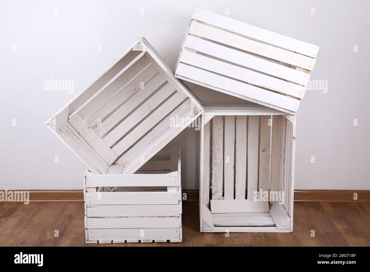 Empty wooden crates in room Stock Photo - Alamy