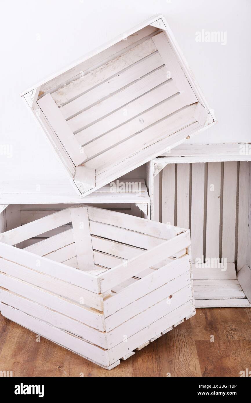 Empty wooden crates in room Stock Photo - Alamy