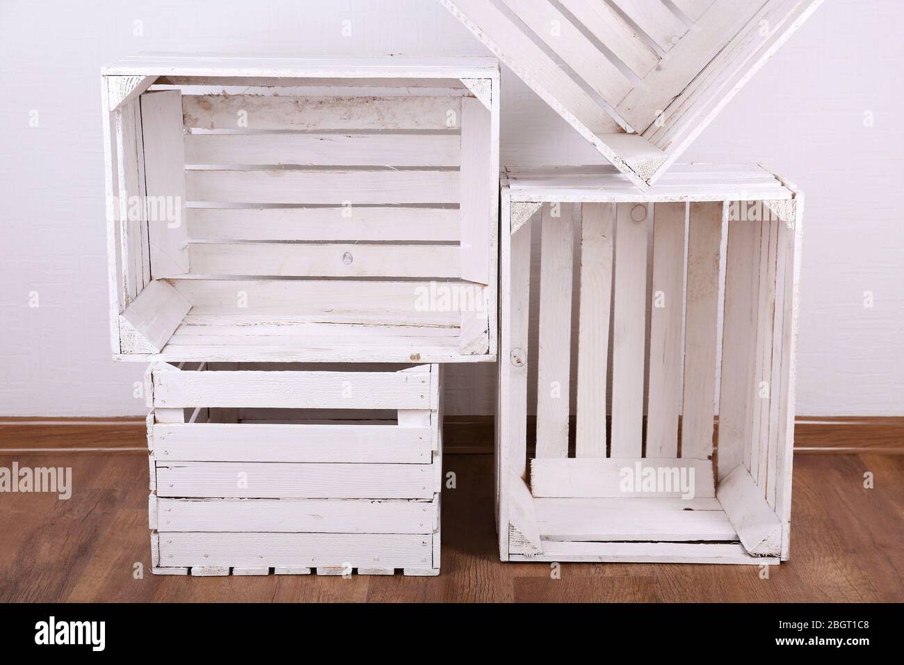 Empty wooden crates in room Stock Photo - Alamy
