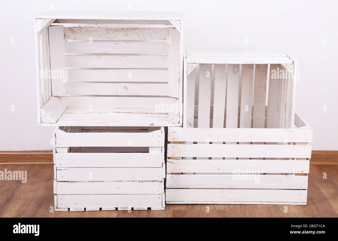 Empty wooden crates in room Stock Photo - Alamy