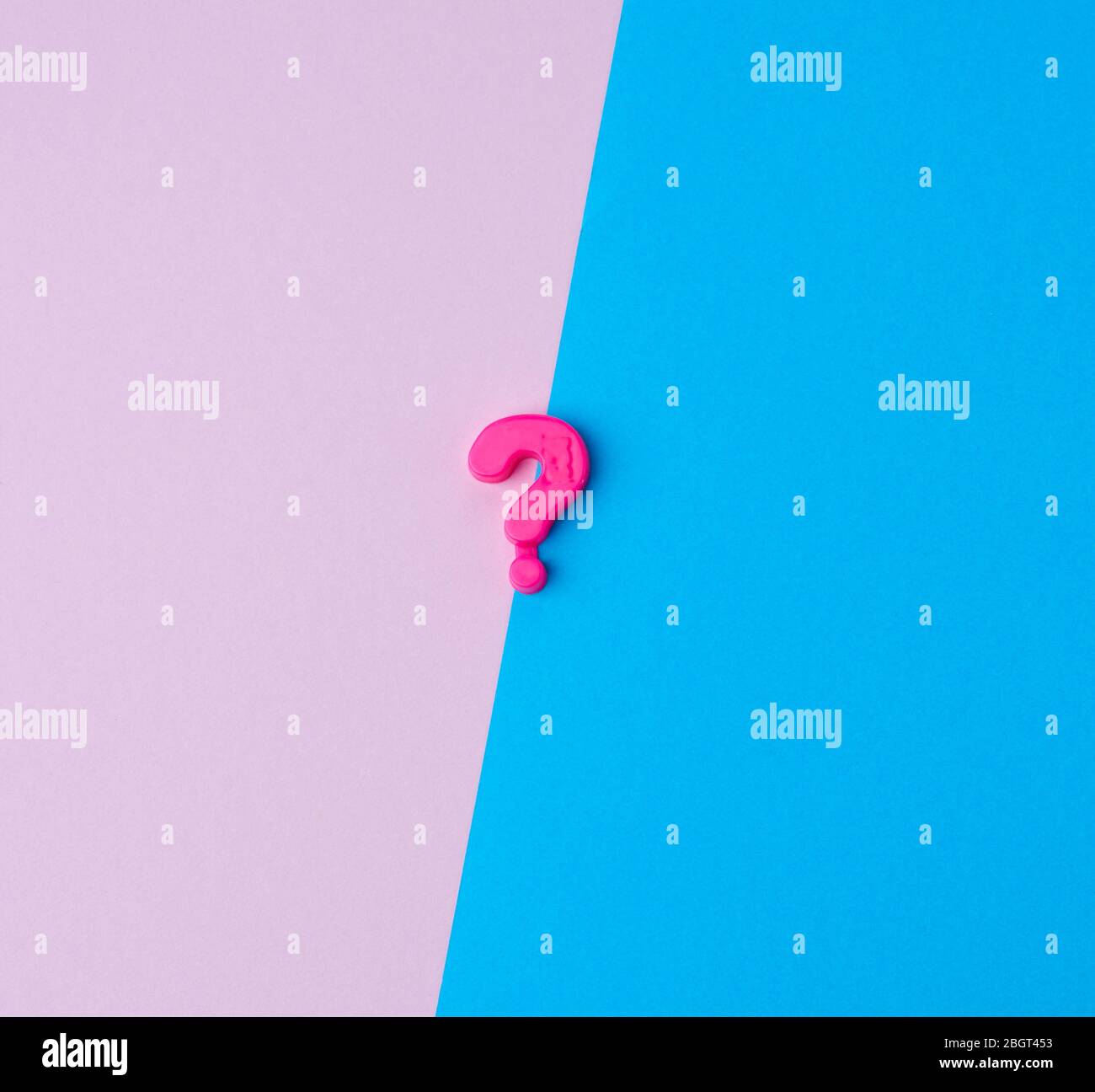 plastic question mark on a colored background, abstract backdrop, close ...