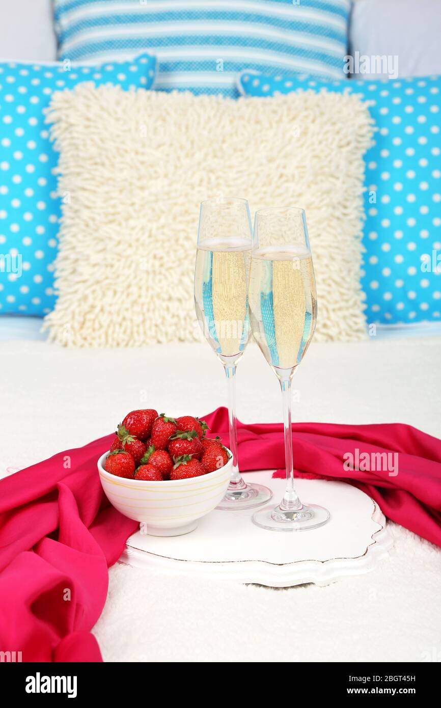 Romantic still life with champagne and strawberry on bed Stock Photo ...