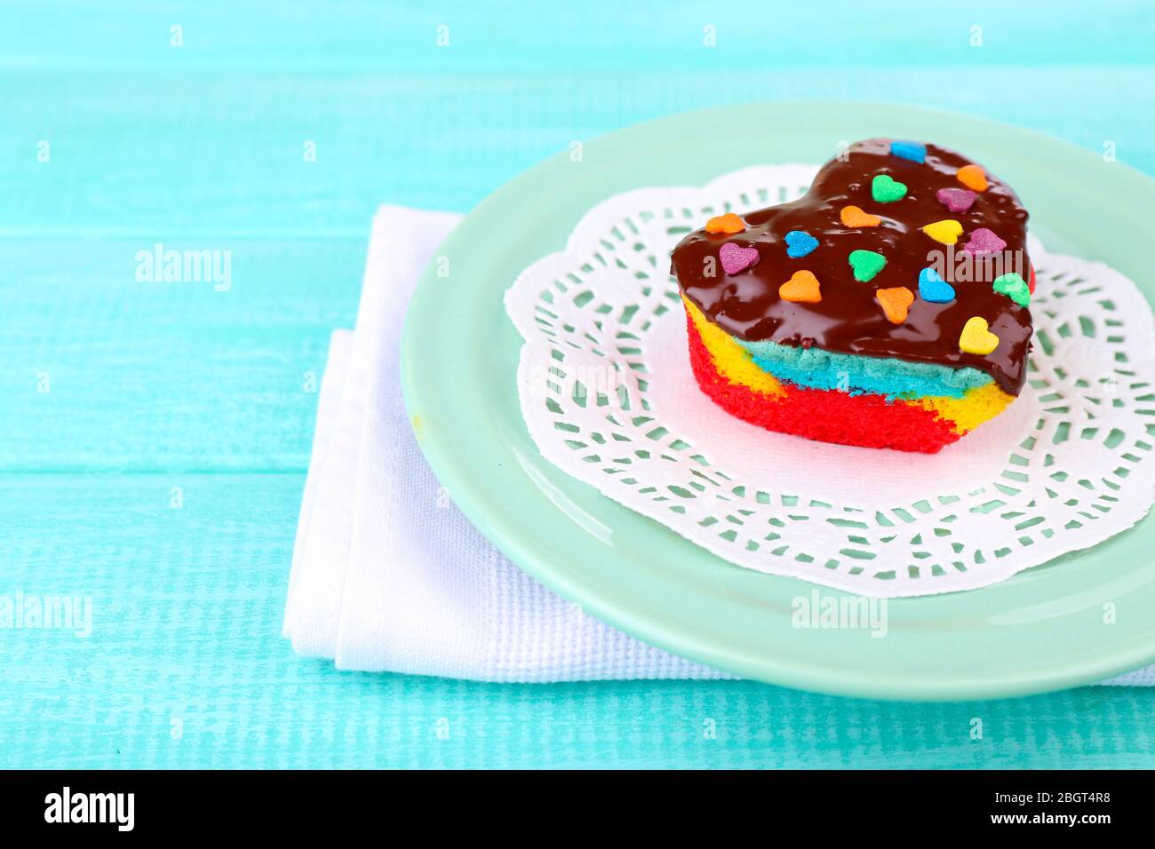 Delicious rainbow mini cake on bright background Stock Photo - Alamy