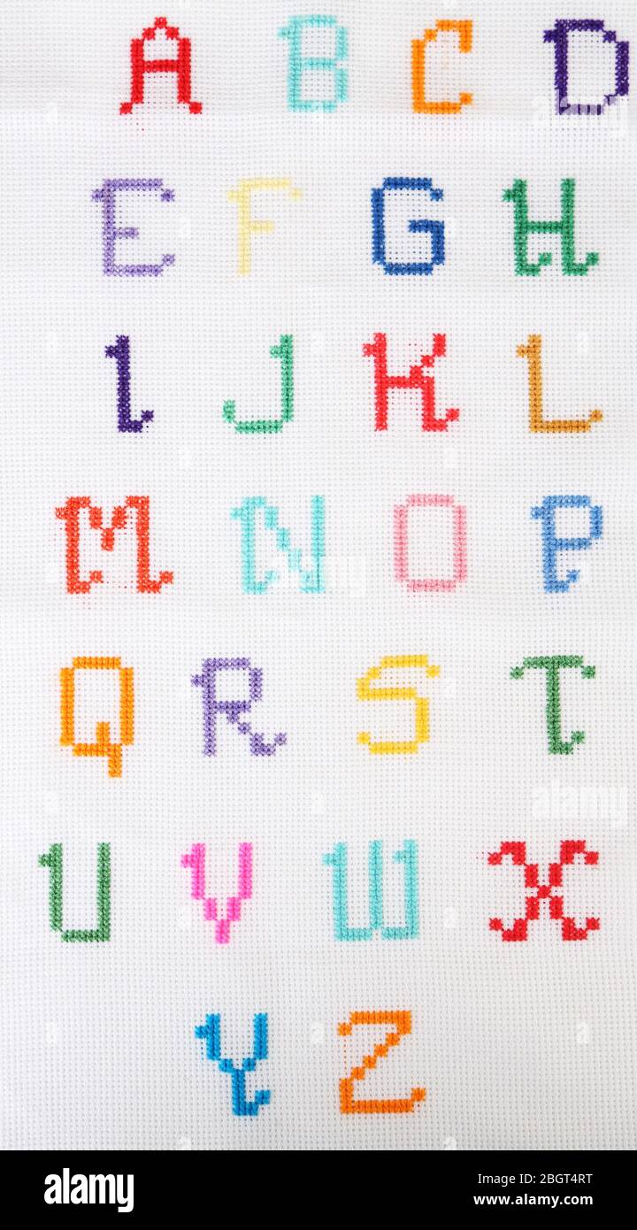 Handmade embroidered letters on white fabric background Stock Photo - Alamy