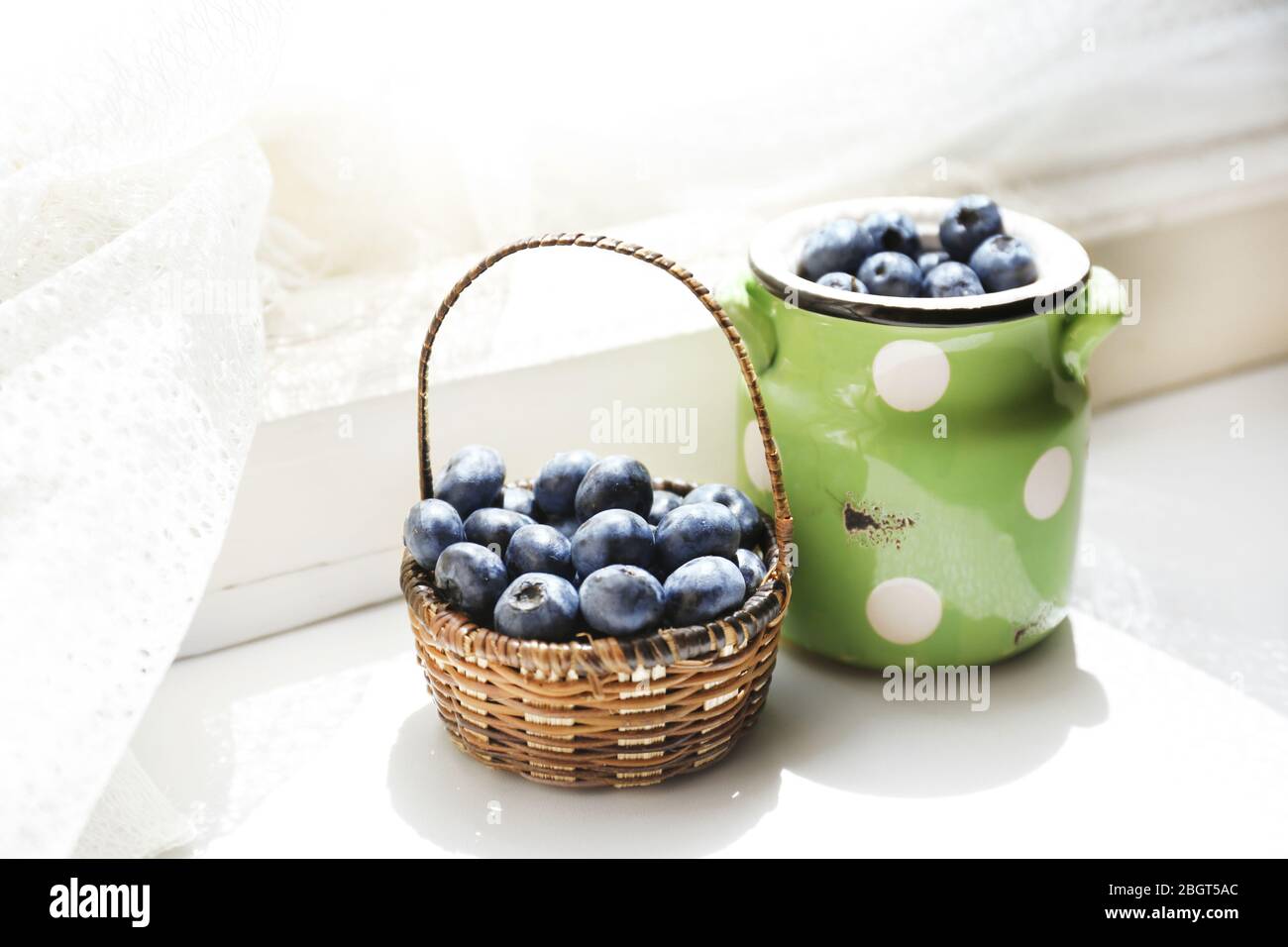 Fresh blueberries on window sill Stock Photo - Alamy