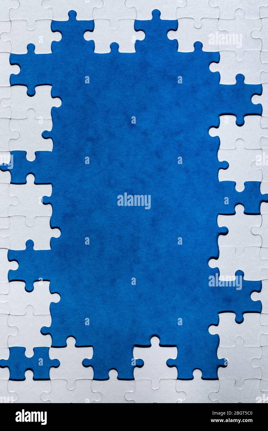 Framing in the form of a rectangle, made of a white jigsaw puzzle ...