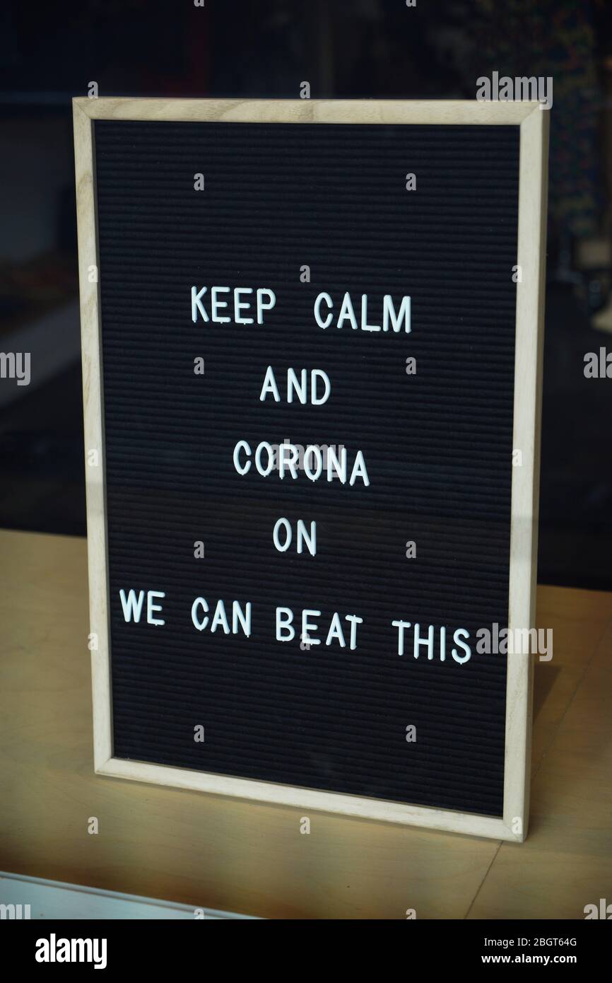 Adult and child face masks in stock hand written signs in a pharmacy ...