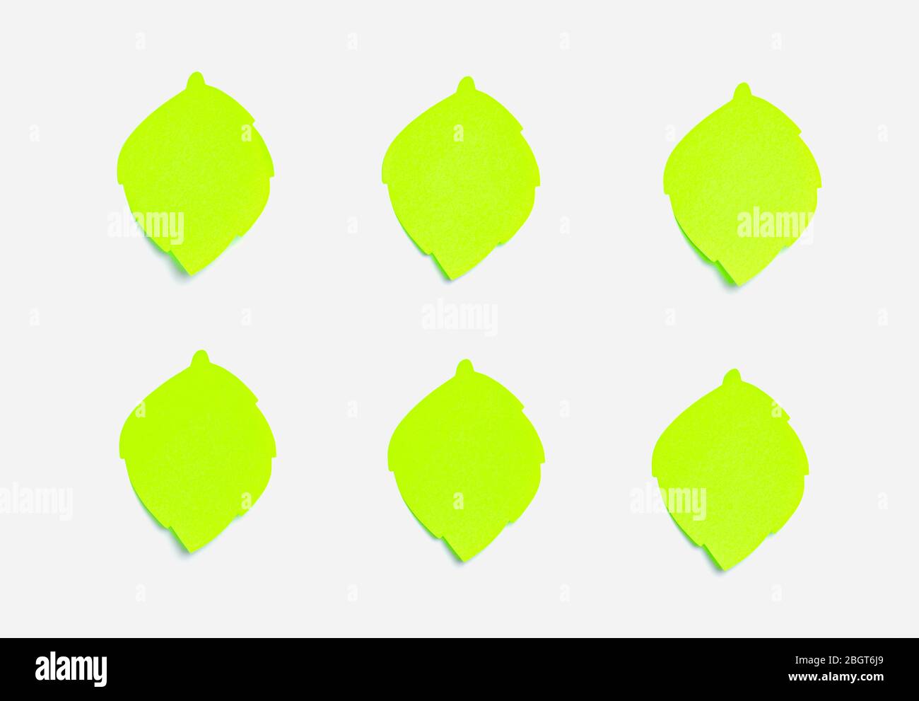 Many stickers note green leafs isolated on white background with ...