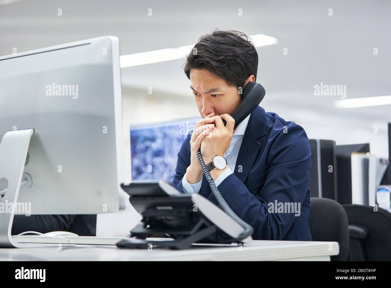 Tired Japanese businessman in the office Stock Photo - Alamy