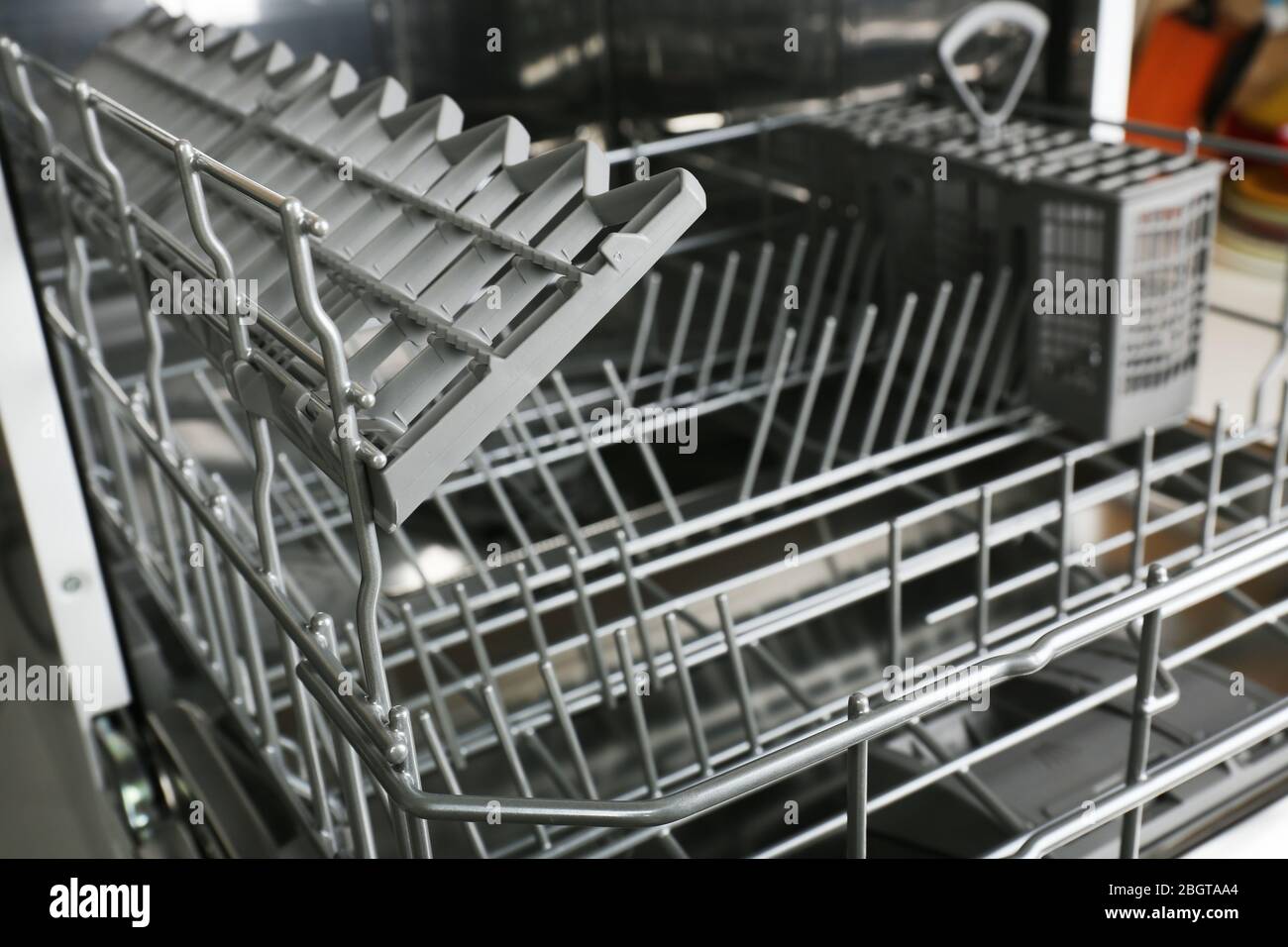 Open dishwasher without dishes in it Stock Photo - Alamy