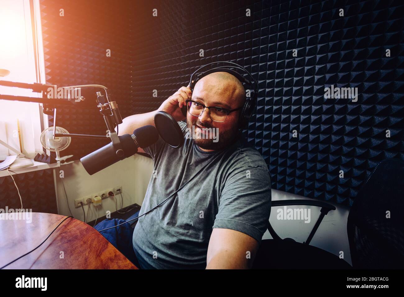 Talking male radio presenter in radio station Stock Photo - Alamy