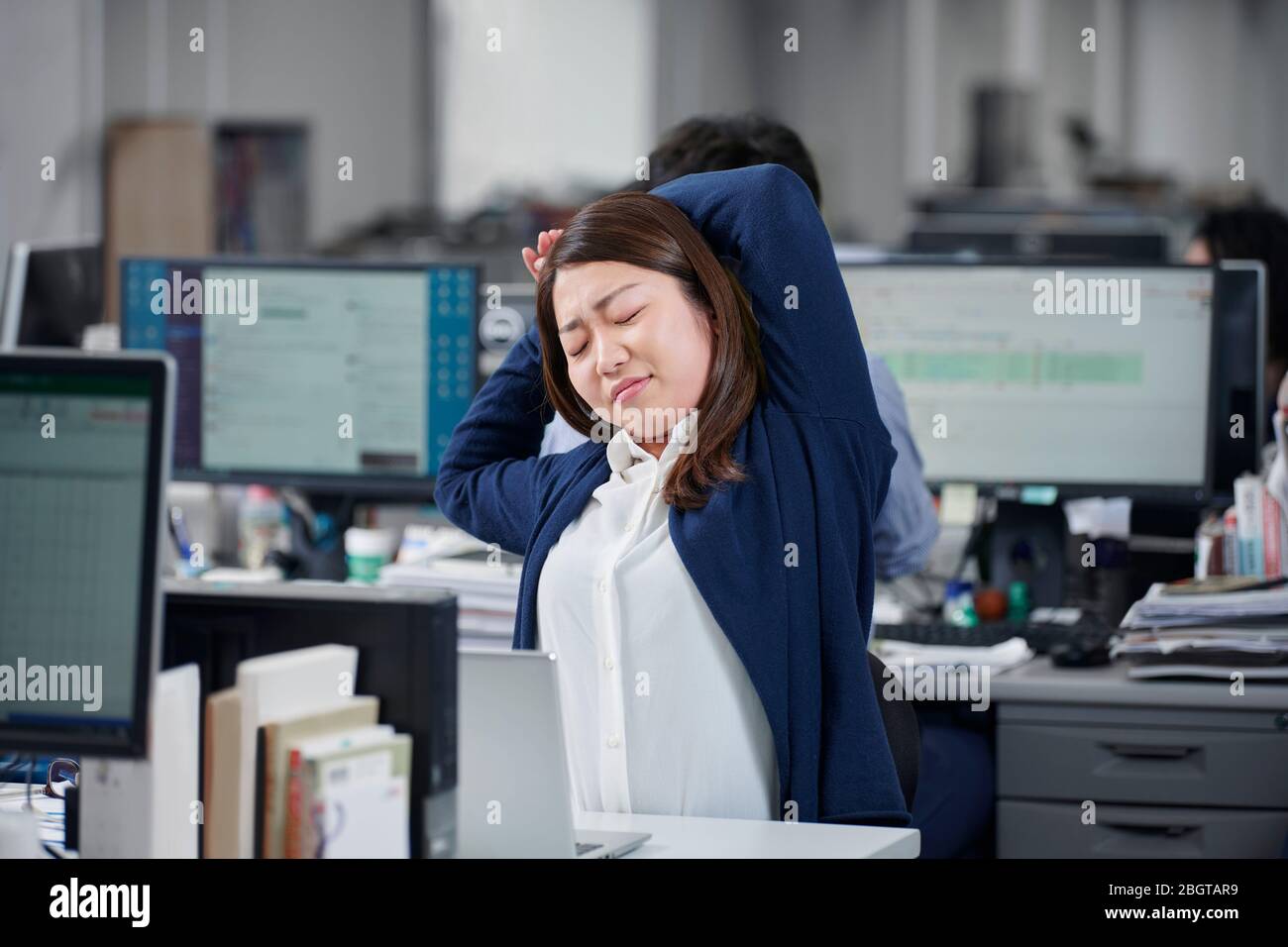 Tired Japanese businesswoman in the office Stock Photo - Alamy