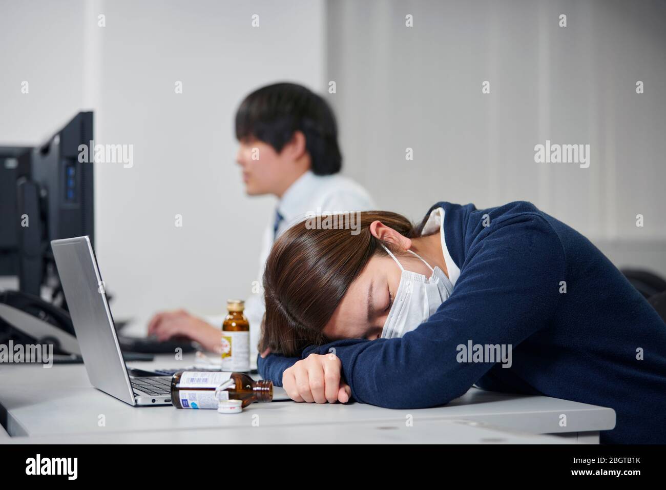 Tired Japanese businesswoman in the office Stock Photo - Alamy