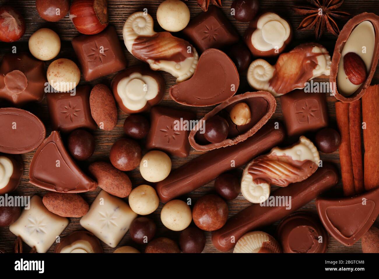 Different kinds of chocolates close-up background Stock Photo - Alamy