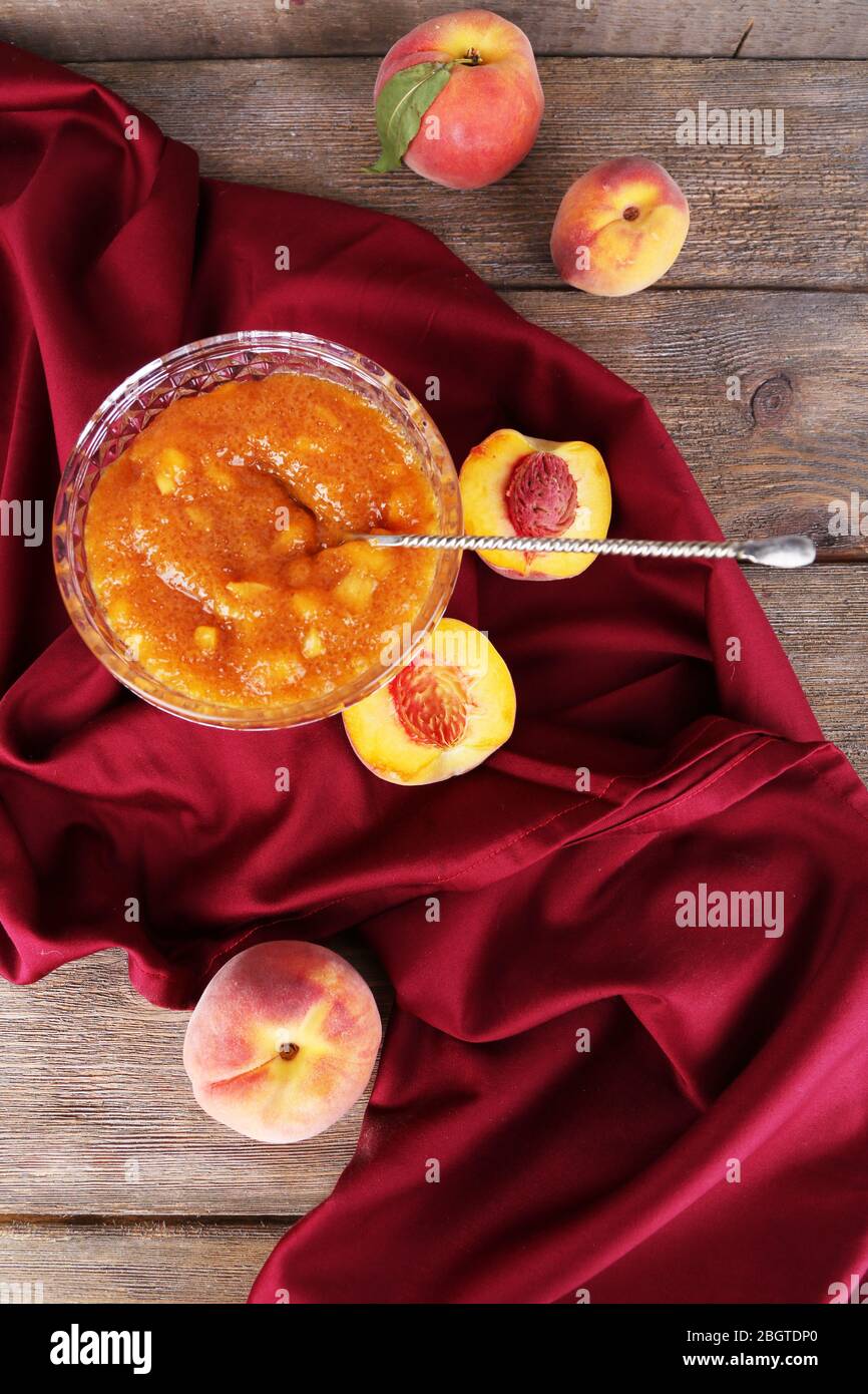 tasty apricot jam with fresh apricots on wooden table Stock Photo - Alamy