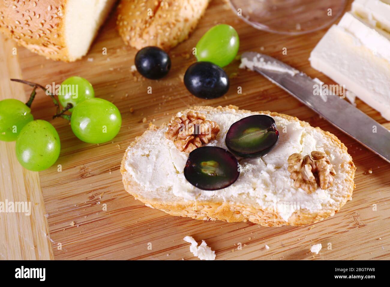 tasty bread with grape and cheese, close up Stock Photo - Alamy