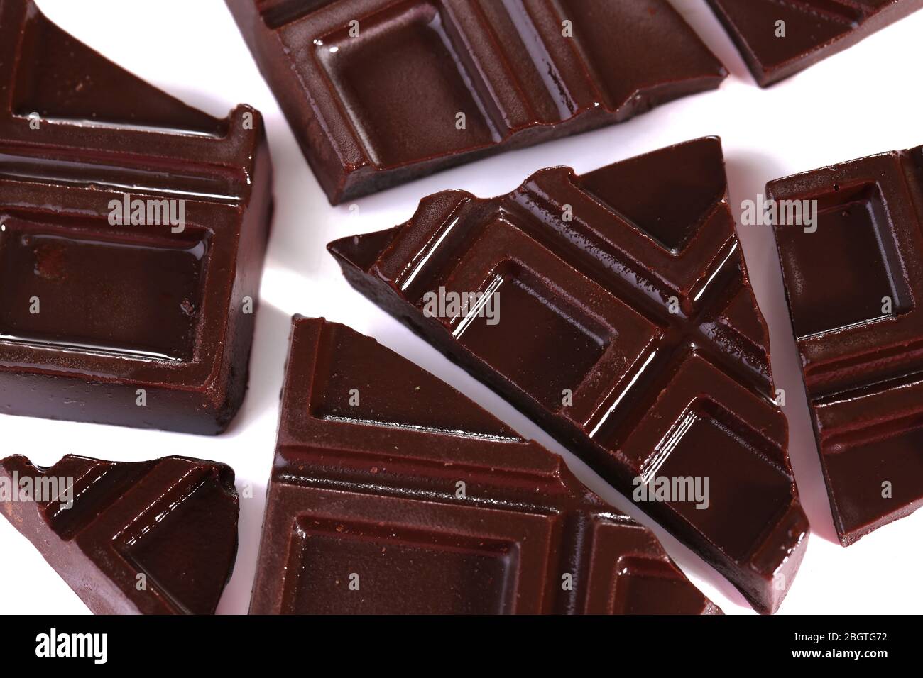 Cracked chocolate bar isolated on white Stock Photo - Alamy