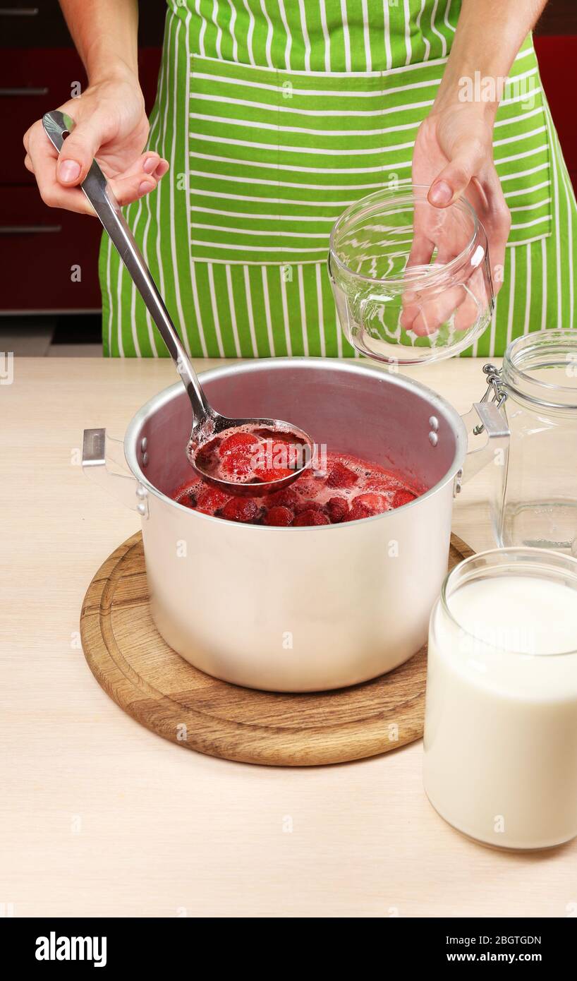 Cooking delicious strawberry jam in kitchen Stock Photo - Alamy