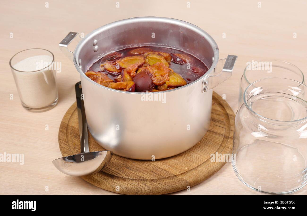 Cooking delicious drain jam in kitchen Stock Photo - Alamy