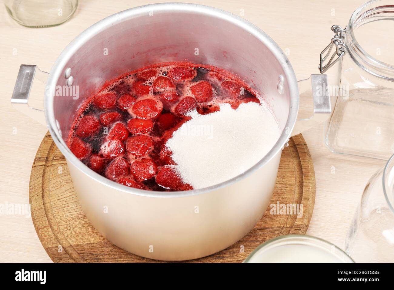 Cooking delicious strawberry jam in kitchen Stock Photo - Alamy