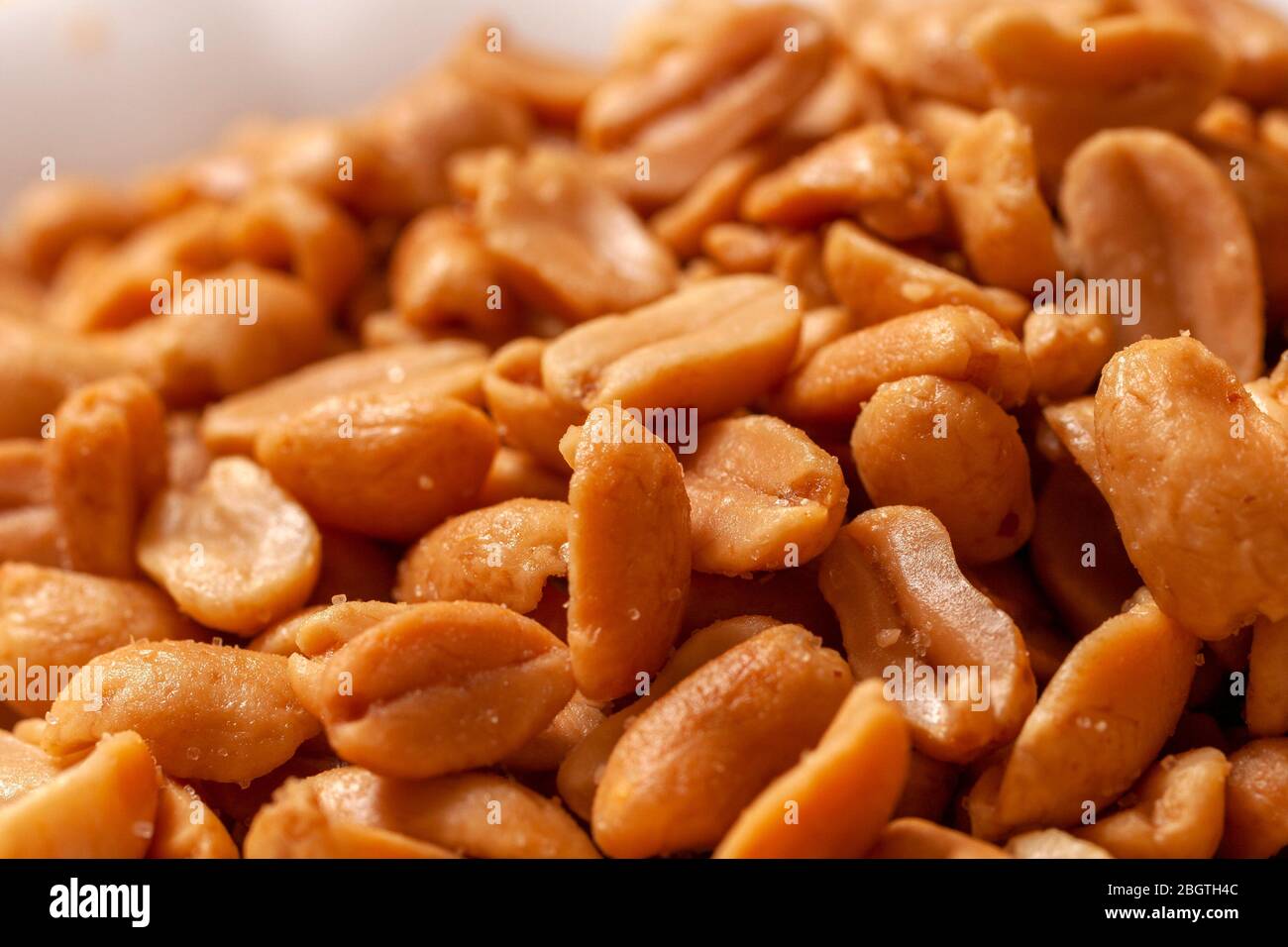 Close up shot of salted peanuts Stock Photo - Alamy