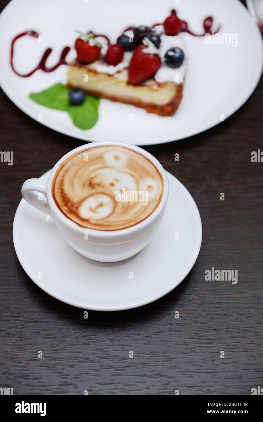 Cup of coffee with cute drawing in cafe Stock Photo - Alamy