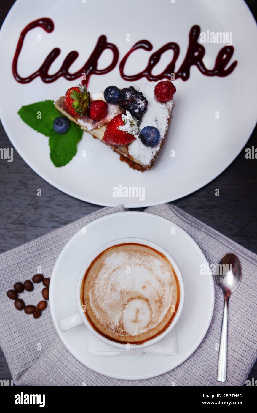 Cup of coffee with cute drawing in cafe Stock Photo - Alamy
